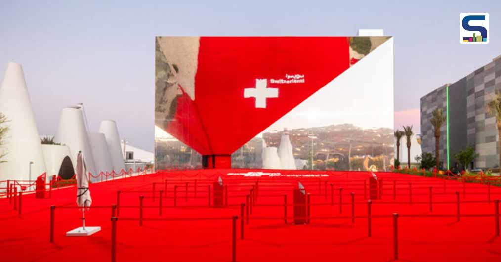 A Colossal Inclined Mirror Wraps The Front of The Swiss Pavilion at ...