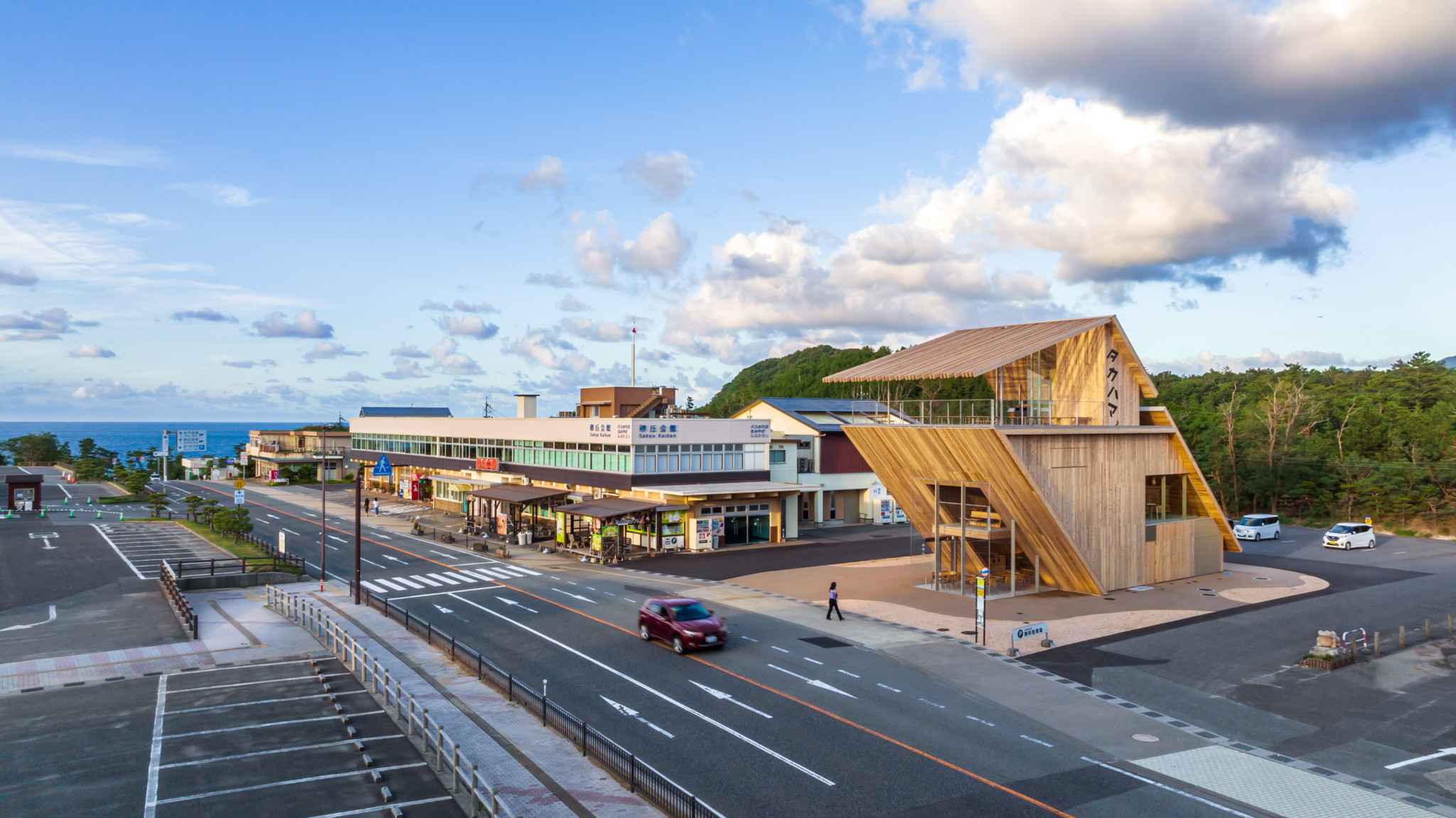 Timber and Concrete Unite to create a Dramatically Sloping Roof Café ...